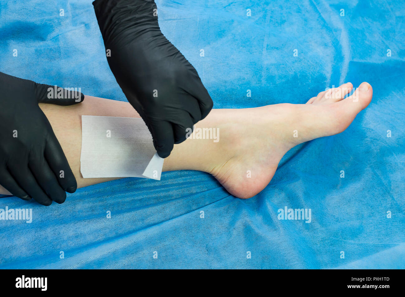 Process depilation female legs and hands in a beauty salon Stock Photo ...