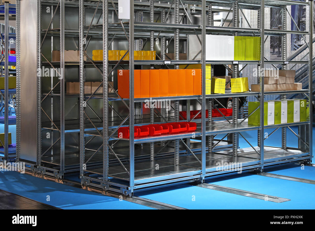 Mobile metal shelves storage system in warehouse Stock Photo - Alamy