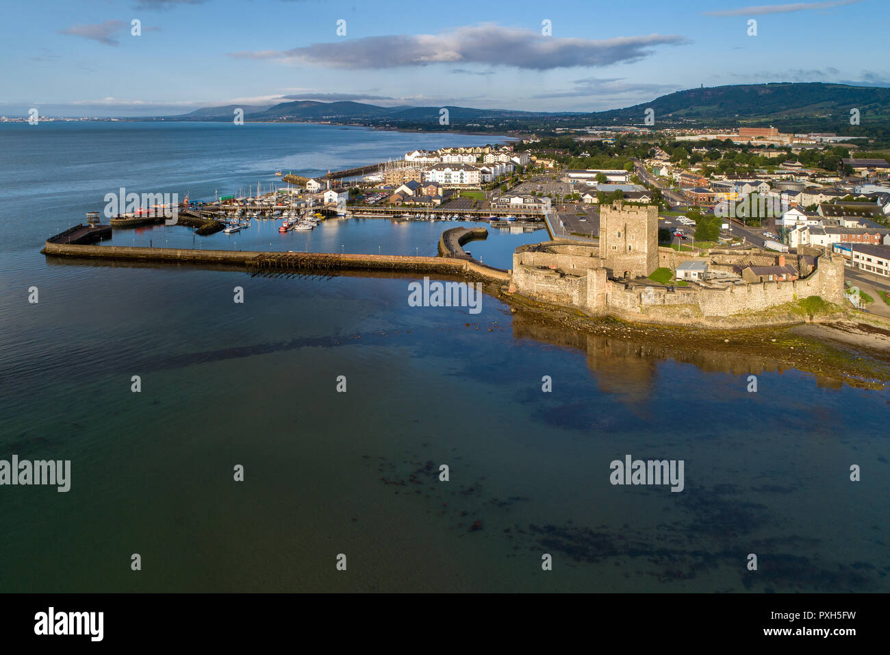 Medieval Norman Castle in Carrickfergus near Belfast in sunrise light ...