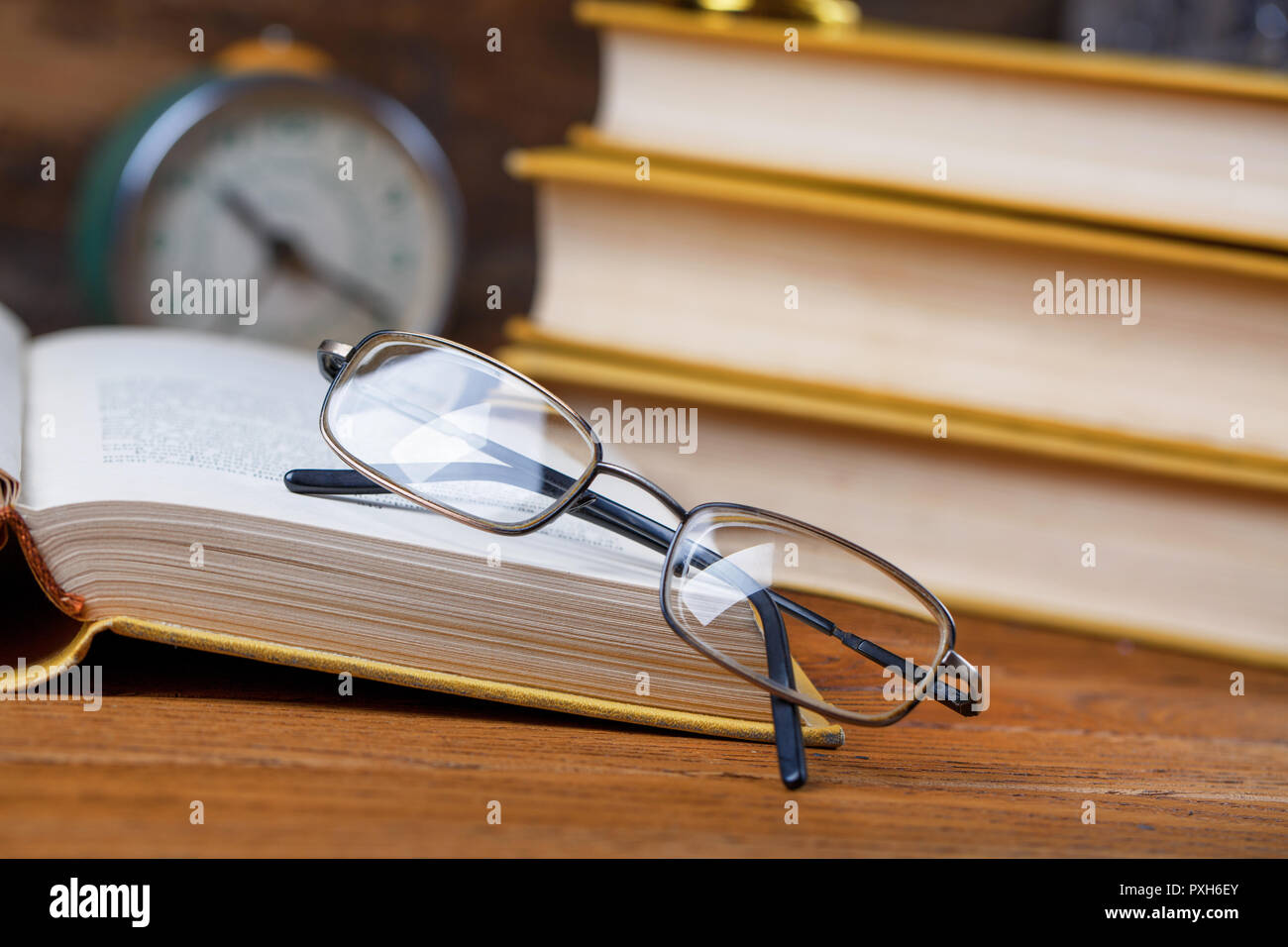 Open book ready for reading on the desk Stock Photo - Alamy