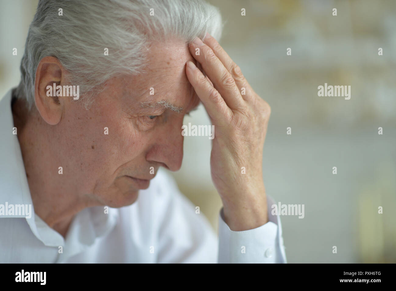 Portrait of a sad senior man posing Stock Photo - Alamy