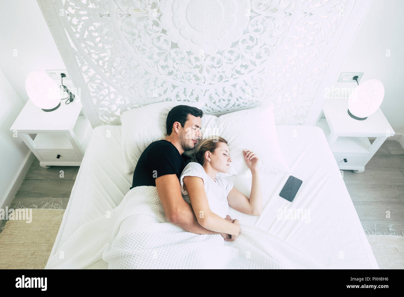Above view of couple of beautiful young people male and female sleep ...