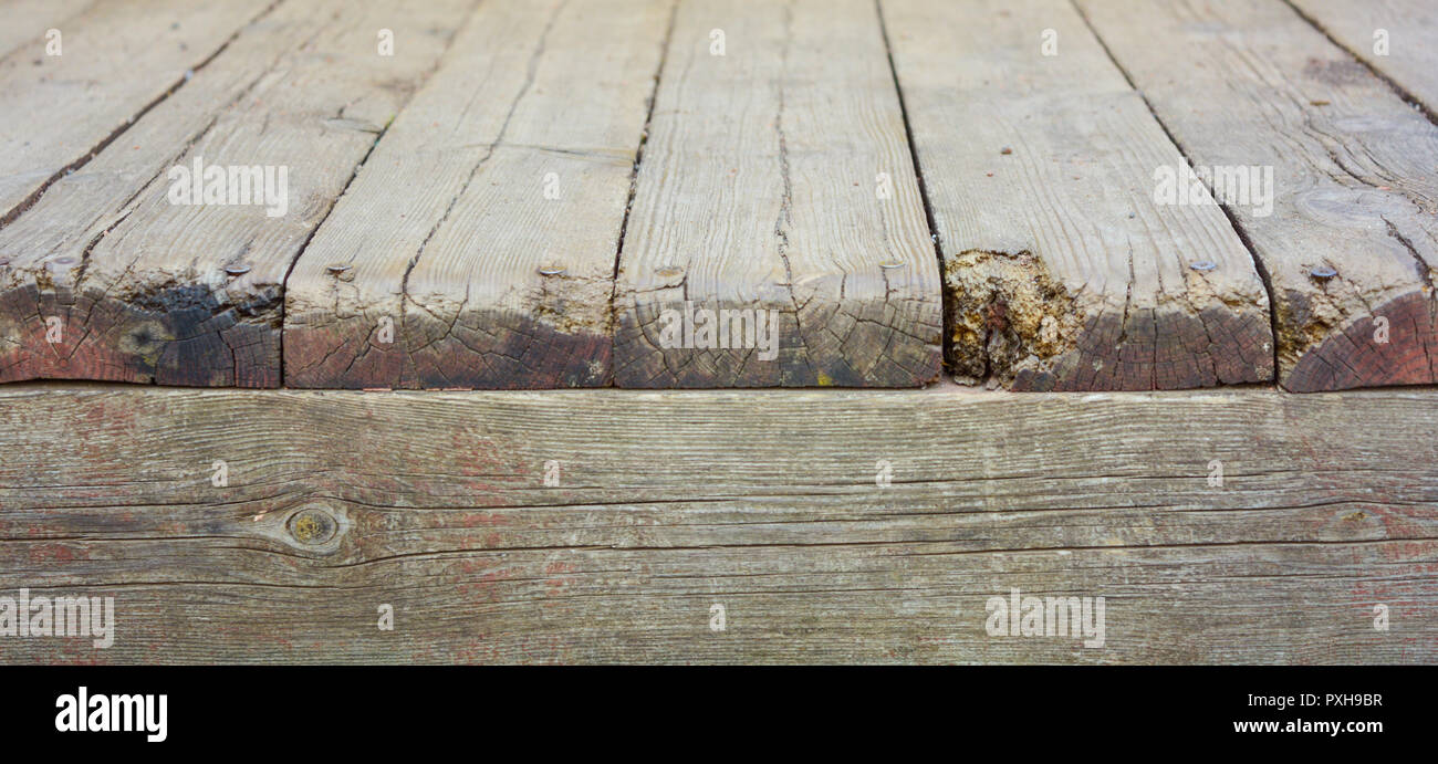Aged room interior with wood floor and wood wall. Distressed surface ...