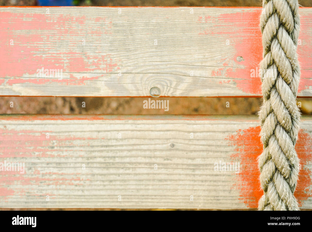 Old rope on background of distressed red painted wood planks Stock ...