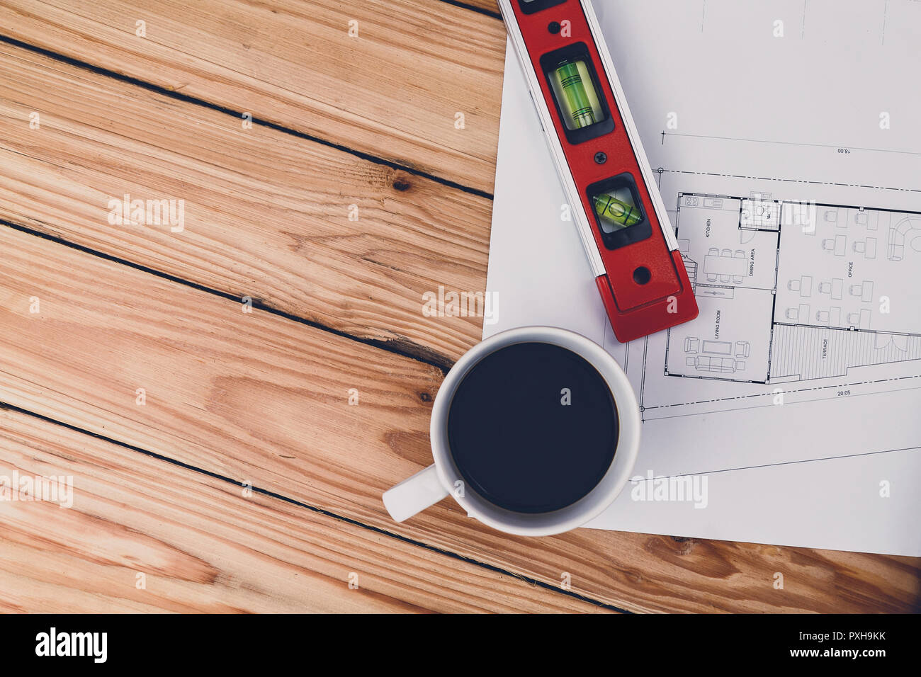 Cup of coffee with measurement tool and blueprint, architectural ...