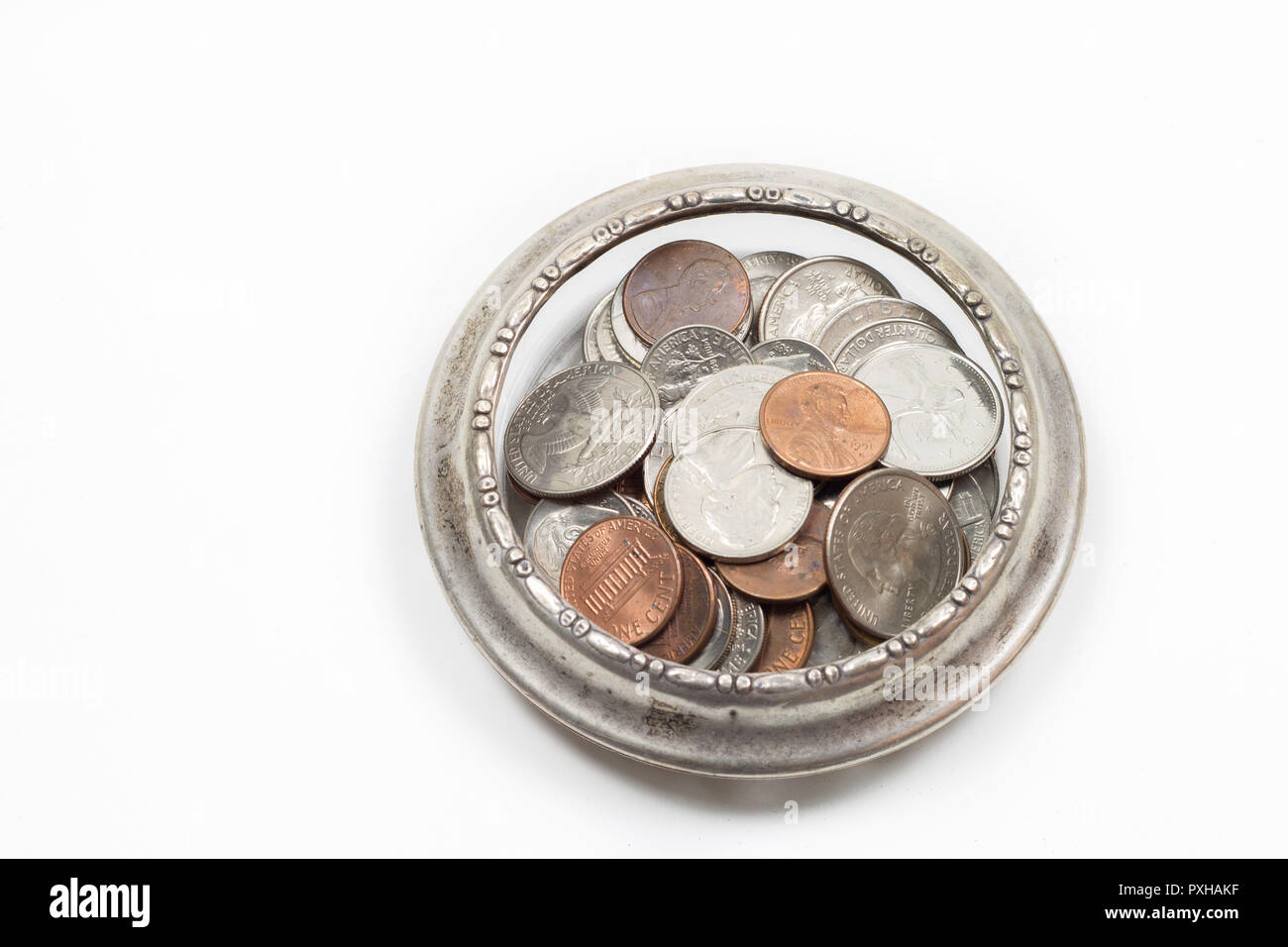 Coins in a sterling silver & glass antique dish Stock Photo - Alamy