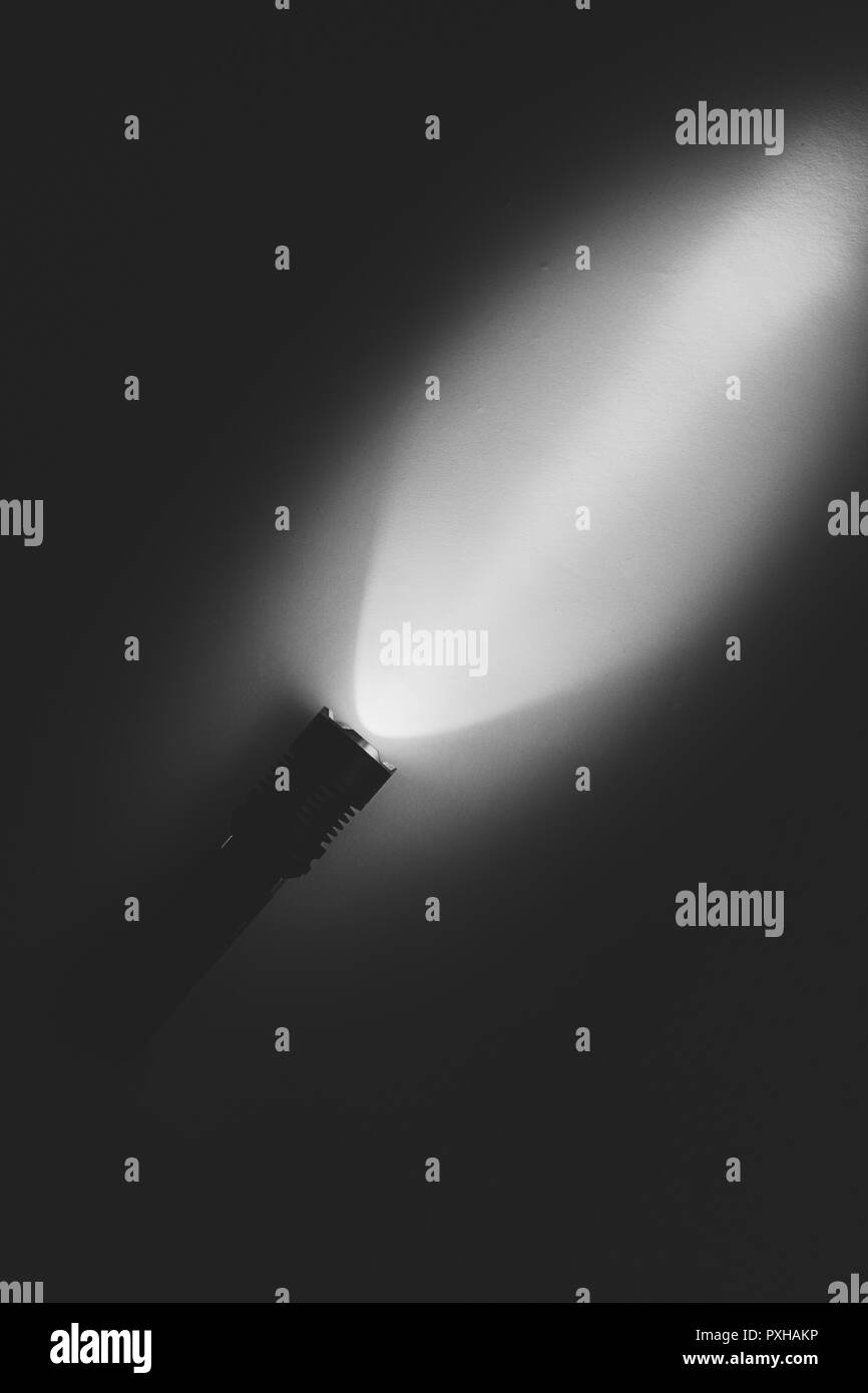 Flashlight at night with beam in black and white Stock Photo - Alamy