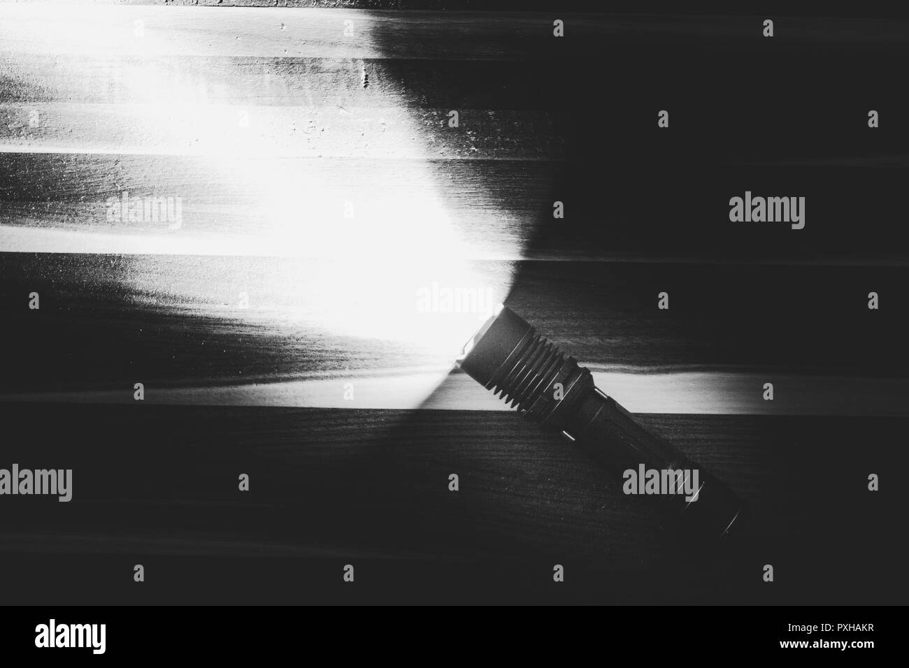 Flashlight at night with beam in black and white Stock Photo - Alamy