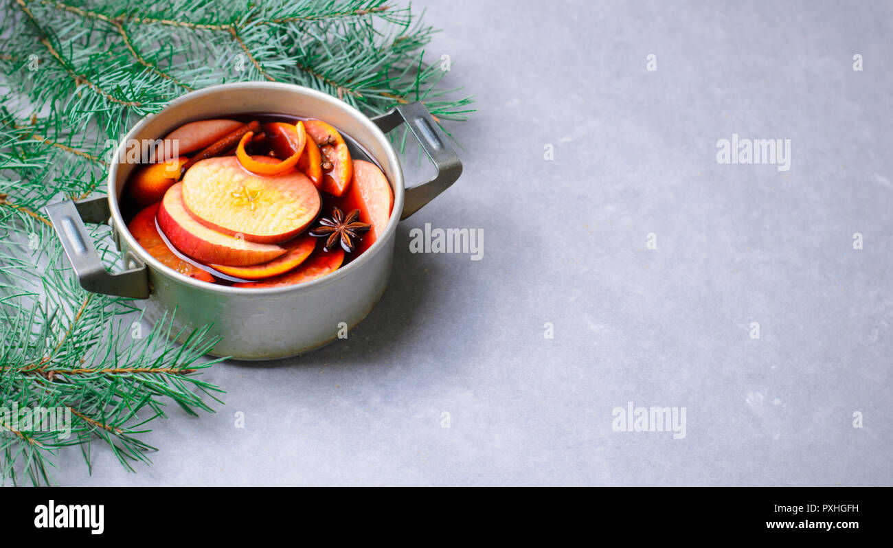 Mulled Wine, Hot Spiced Drink with Orange and Apple in a Vintage Pot ...