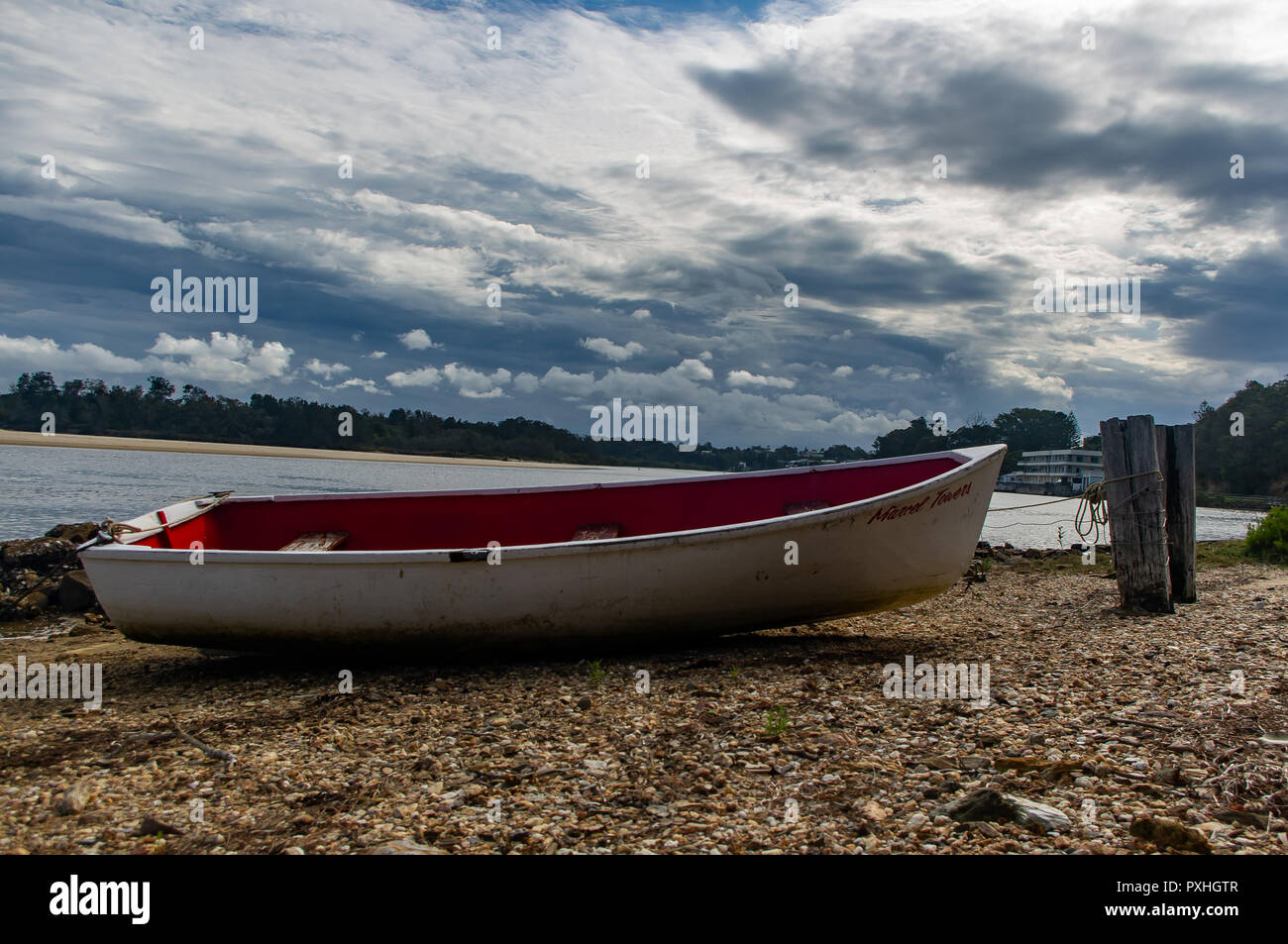row boat next to river Stock Photo - Alamy