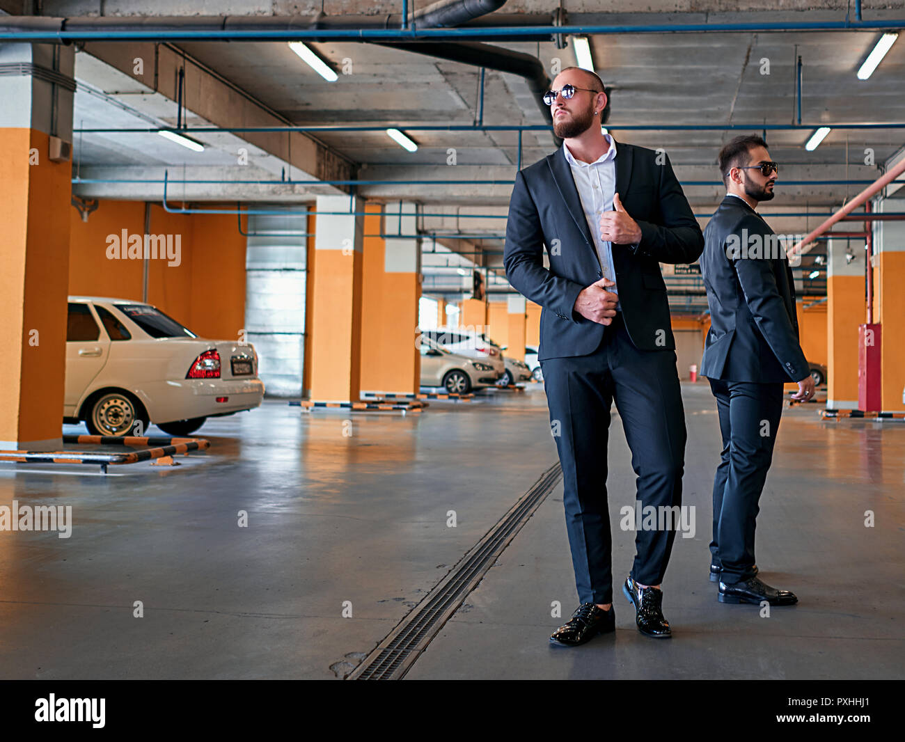 men in jackets in the Parking lot Stock Photo - Alamy