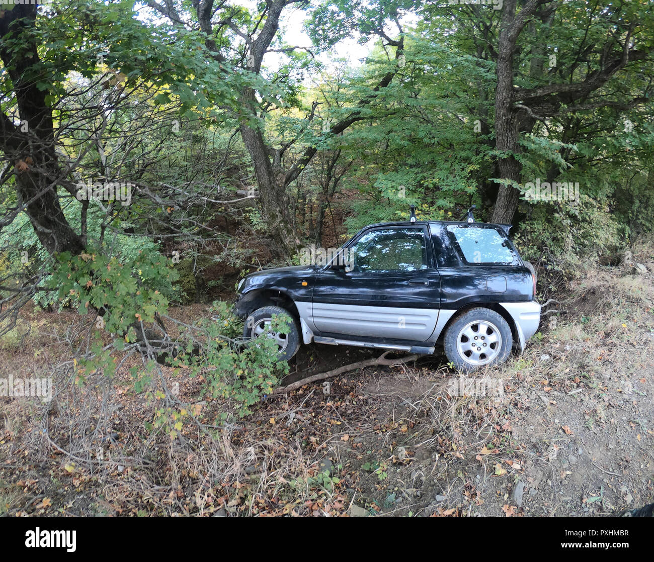 The SUV car crashed off the road in Georgian mountains Stock Photo - Alamy