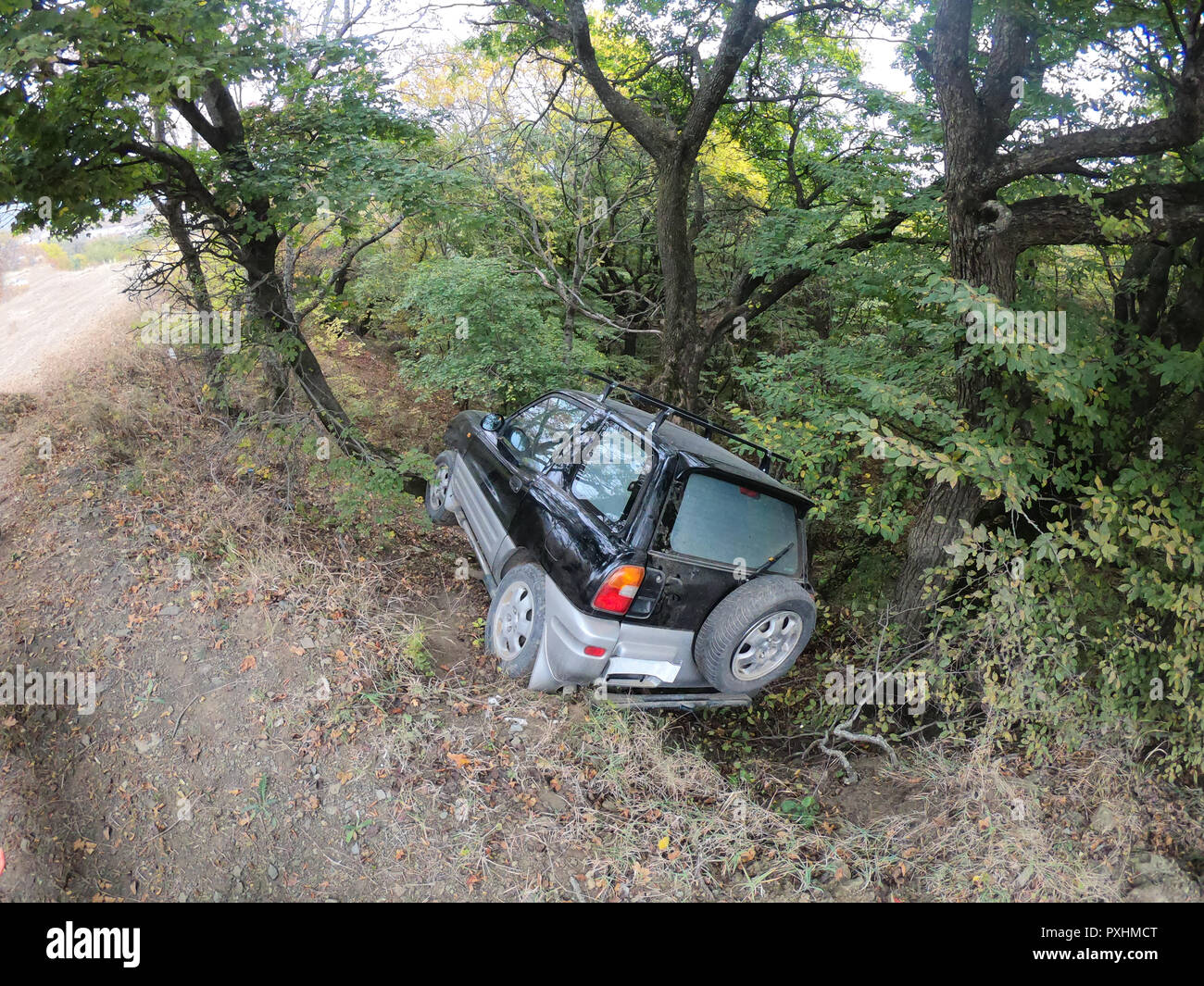 The SUV car crashed off the road in Georgian mountains Stock Photo - Alamy