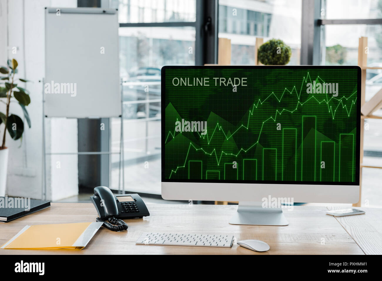 close up view of workplace with computer screen with online trade lettering in office Stock ...