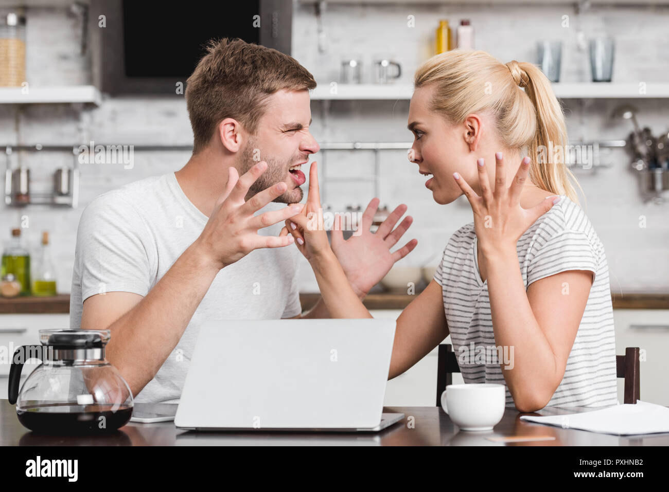 emotional young couple arguing and looking at each other, relationship ...