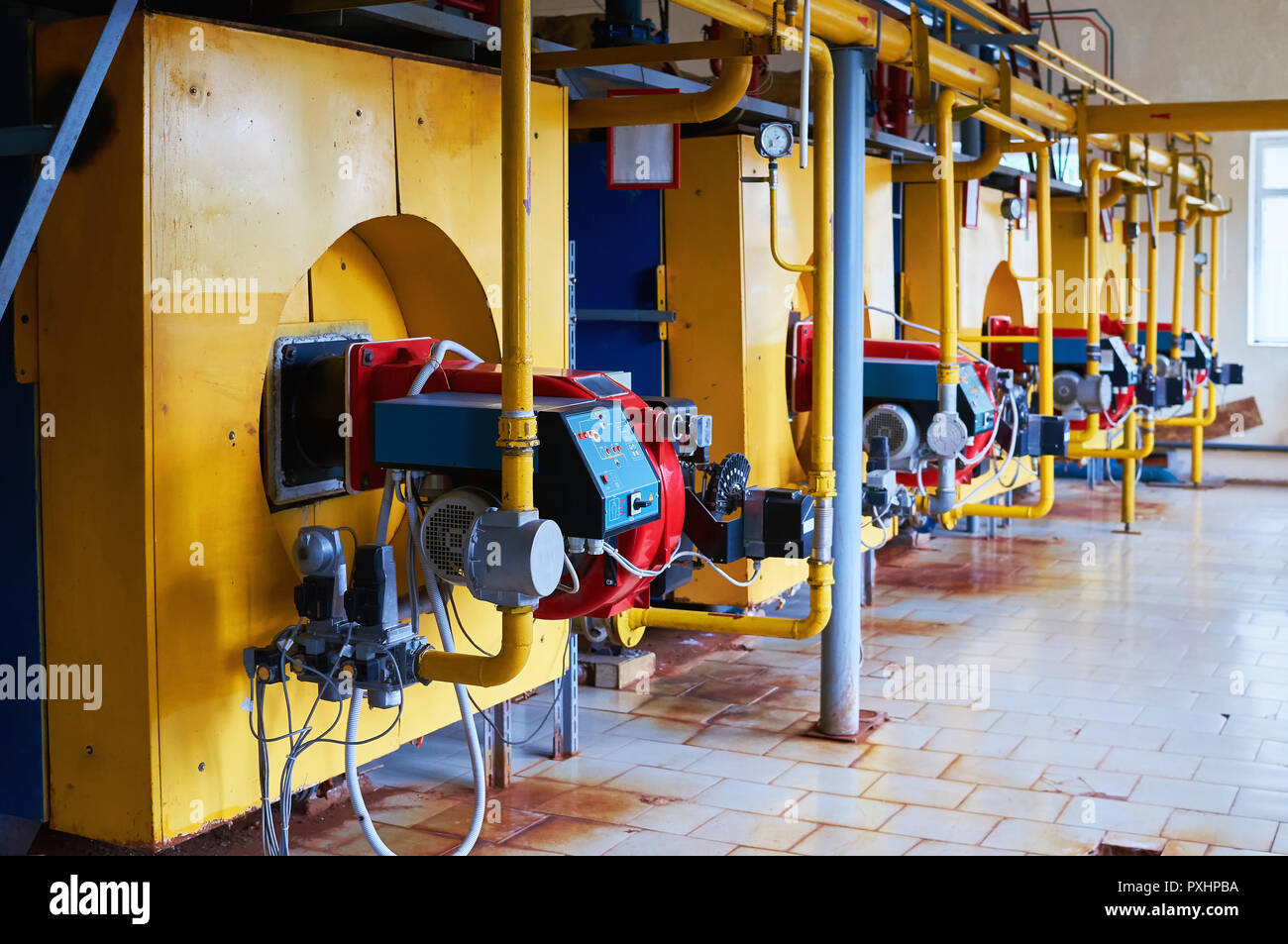 Boiler with four large boilers yellow and red and blue burners Stock ...