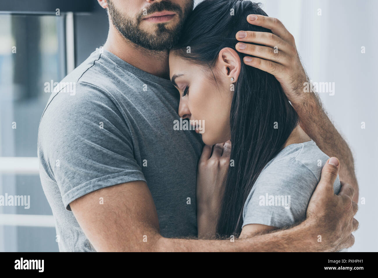 Man hugging woman hi-res stock photography and images - Alamy