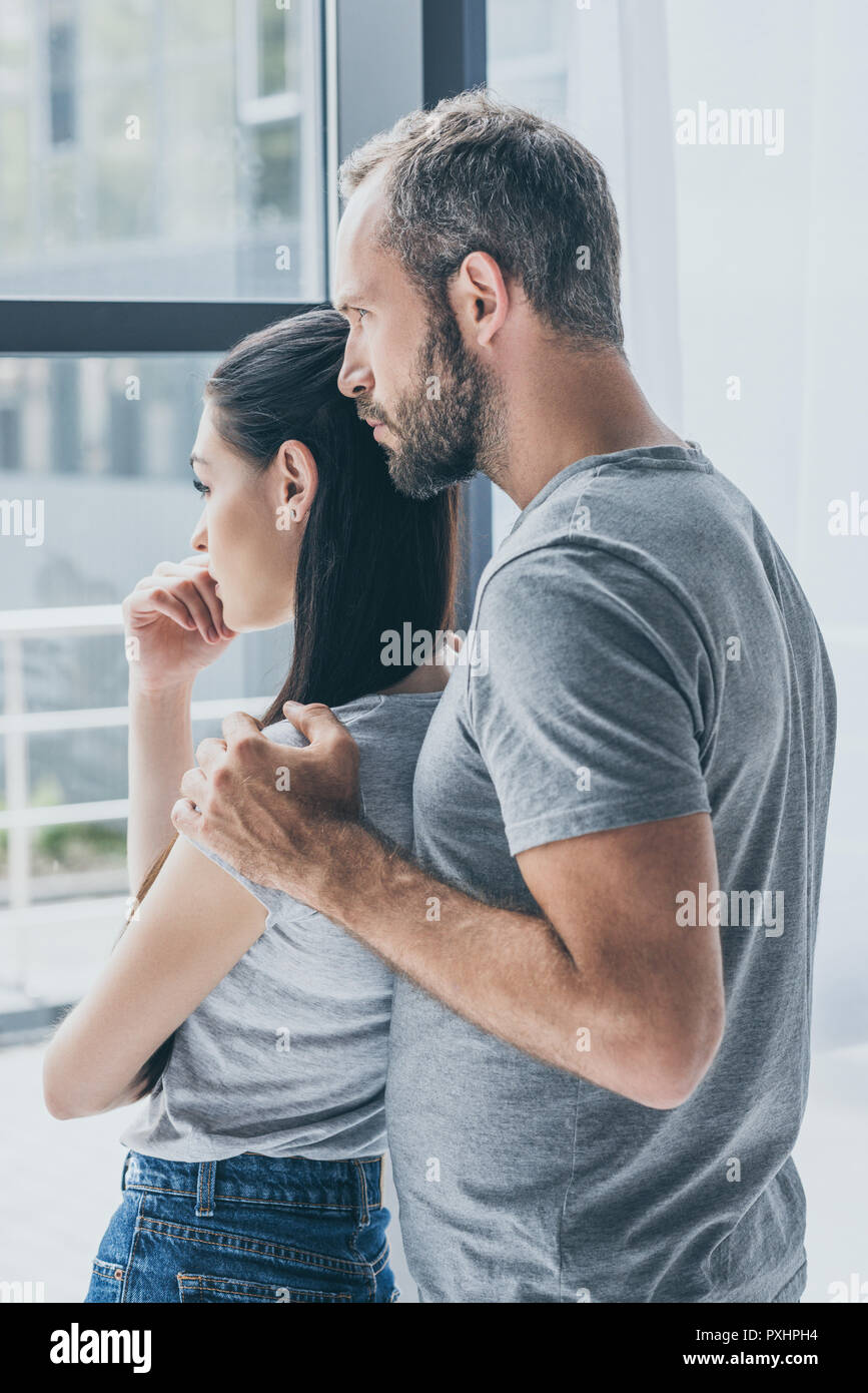 Sad attractive woman standing window hi-res stock photography and ...
