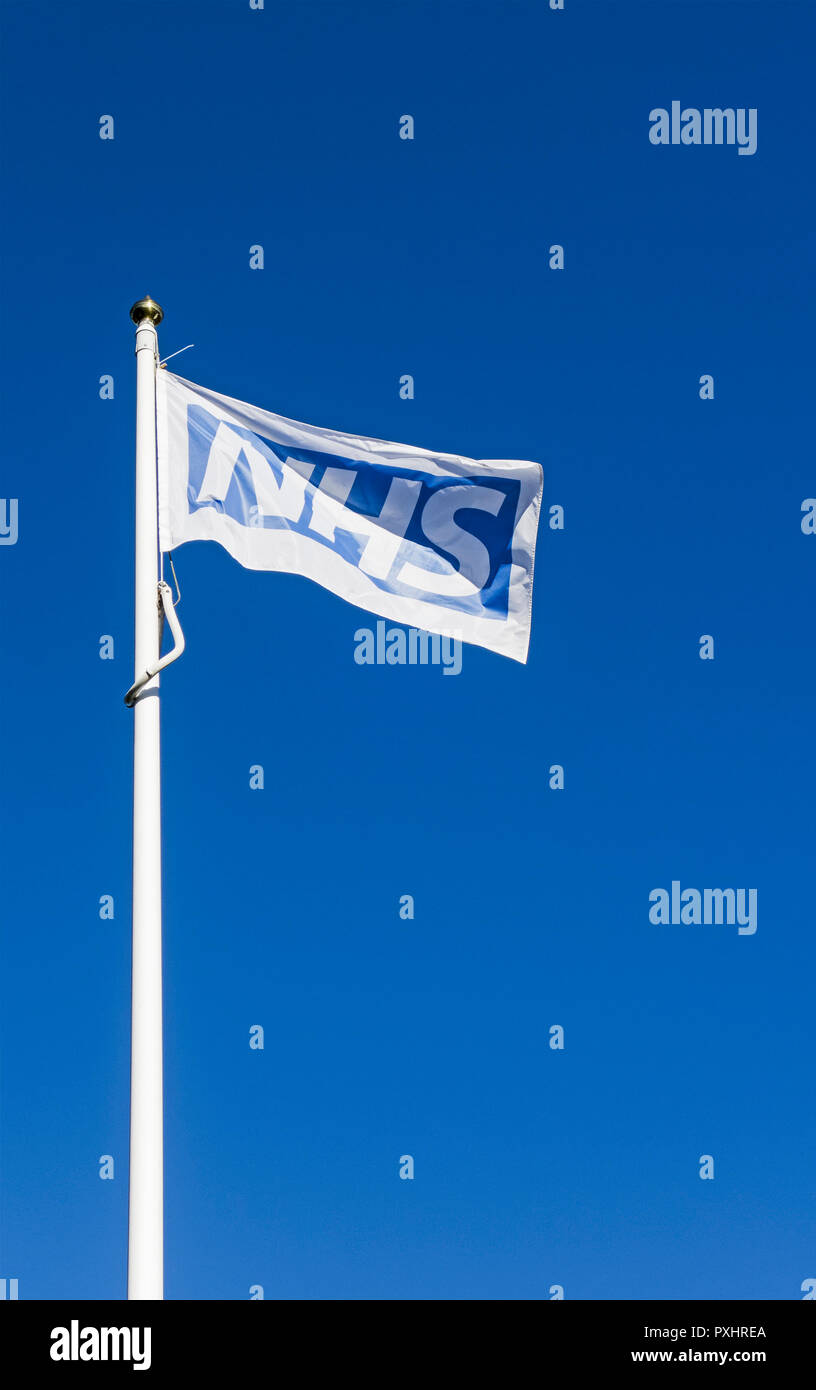 An NHS flag flying on a flagpole against a background of blue sky Stock ...