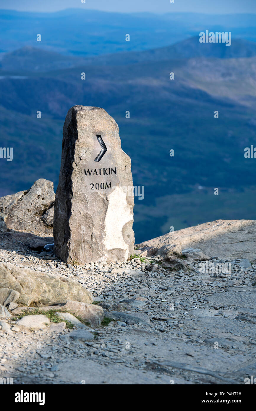 Sign pointing towards the Watkin path at the summit of Snowdon in ...