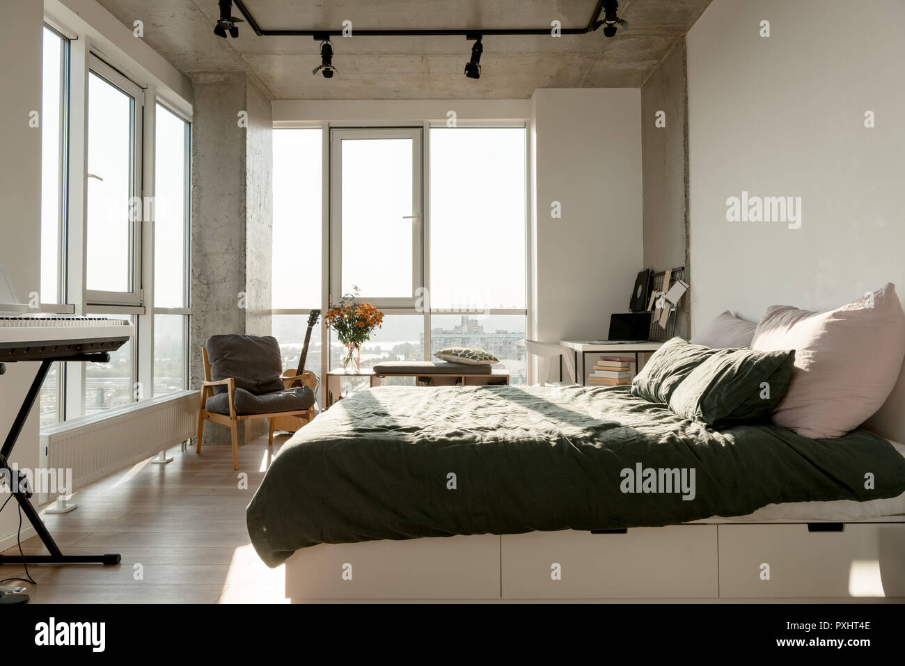 close up view of empty modern room interior with big window and bed ...