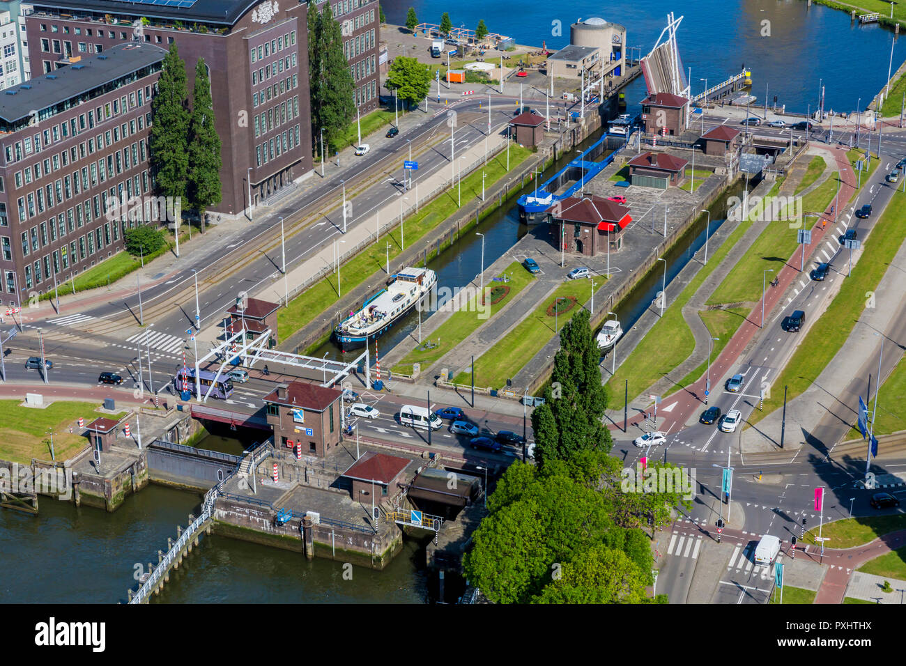 aerial view of boats sailing through a canal in the city of Rotterdam ...