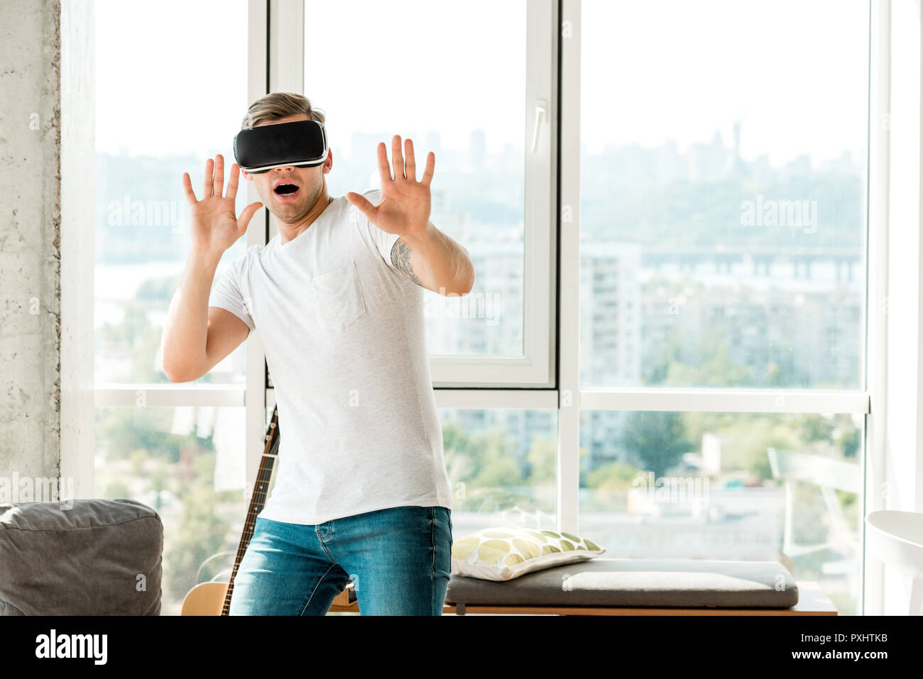 Scared man in vr headset hi-res stock photography and images - Alamy