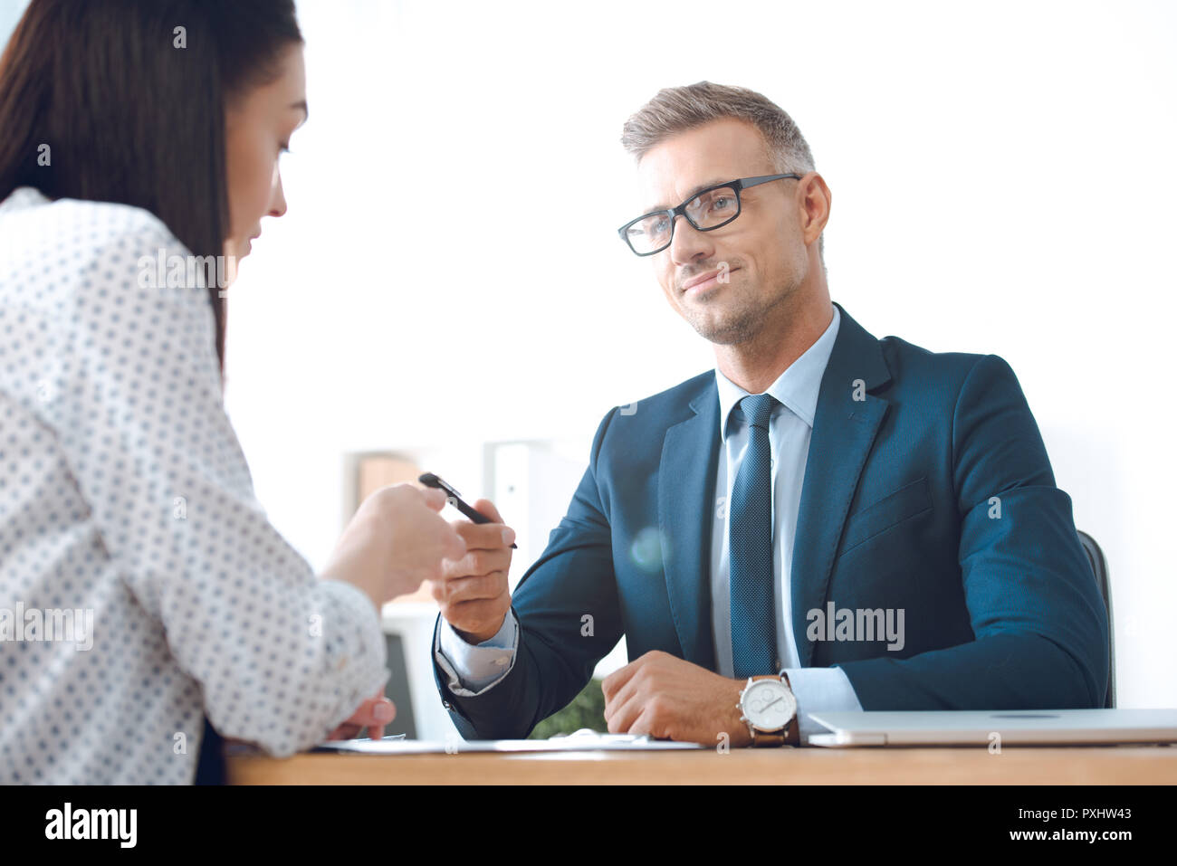 Businessman giving pen client hi-res stock photography and images - Alamy