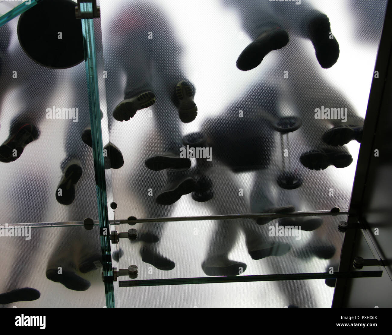 Feet on Glass at NYC Apple Store Stock Photo - Alamy