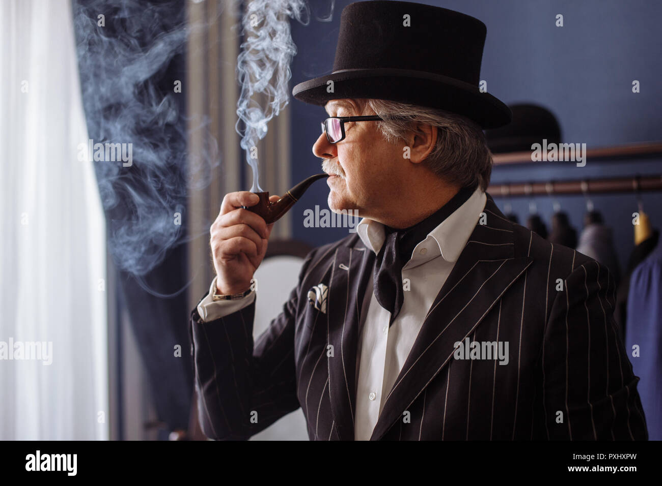 Portrait of posh mature gentleman visiting a tailor's shop Stock Photo ...