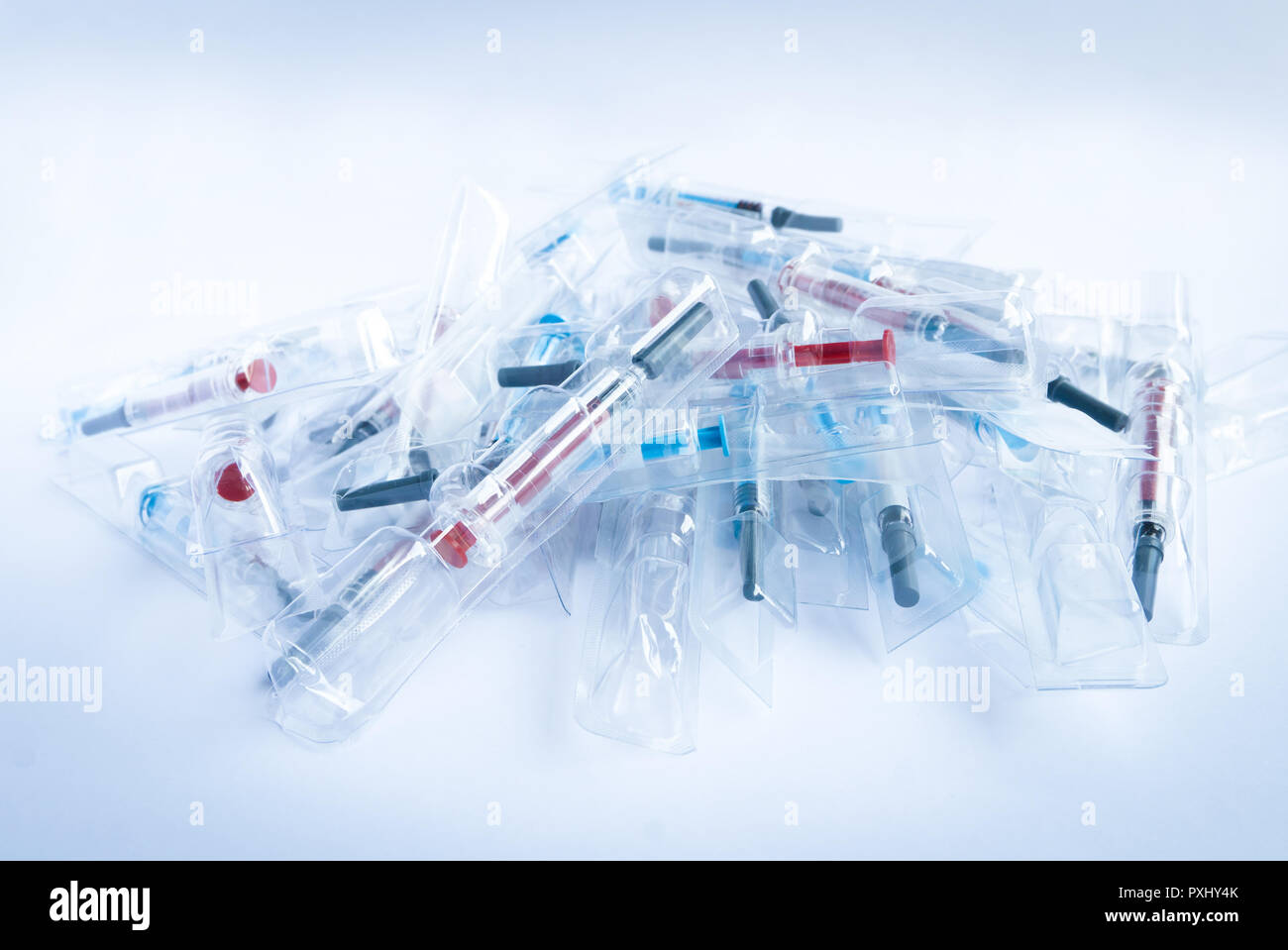 Pile of used syringes, everyday drug therapy Stock Photo - Alamy