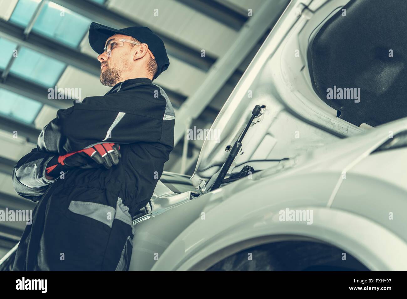 Modern Car Service Maintenance. Satisfied Caucasian Auto Service Worker ...