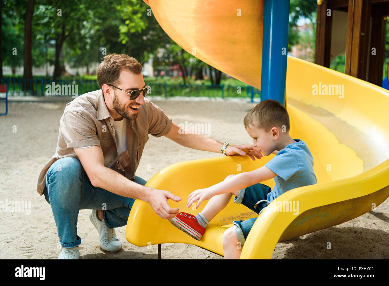 Father and son in playground hi-res stock photography and images - Alamy