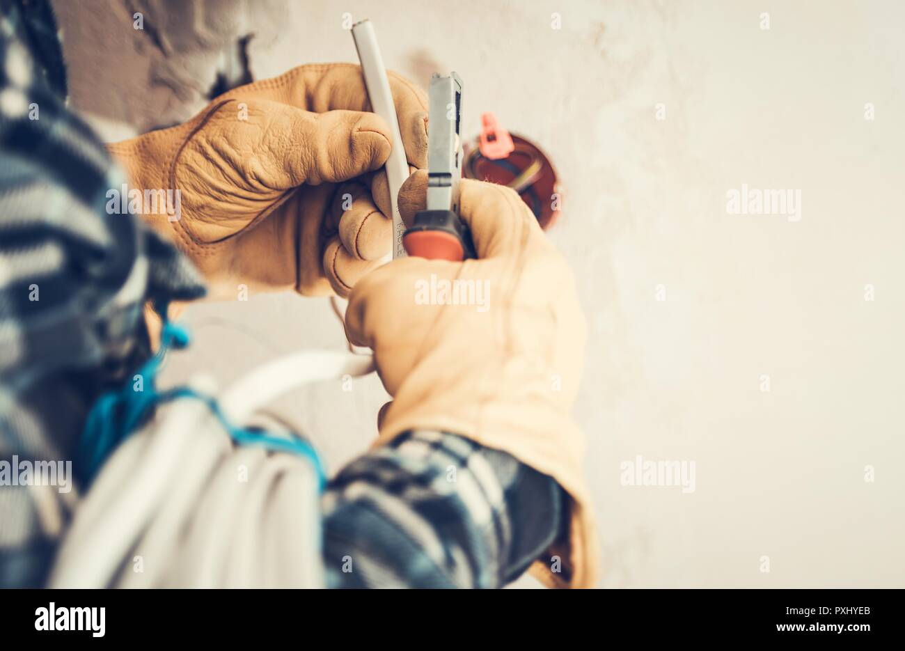 Electrical Installation Works. Closeup Photo. Electrician and the Cable ...
