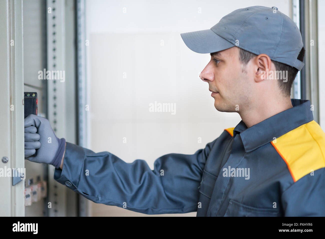 Portrait of an electrician at work Stock Photo - Alamy