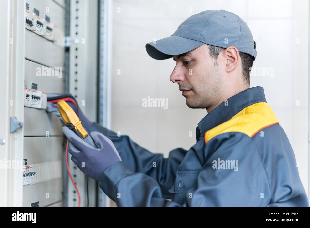 Portrait of an electrician at work Stock Photo - Alamy