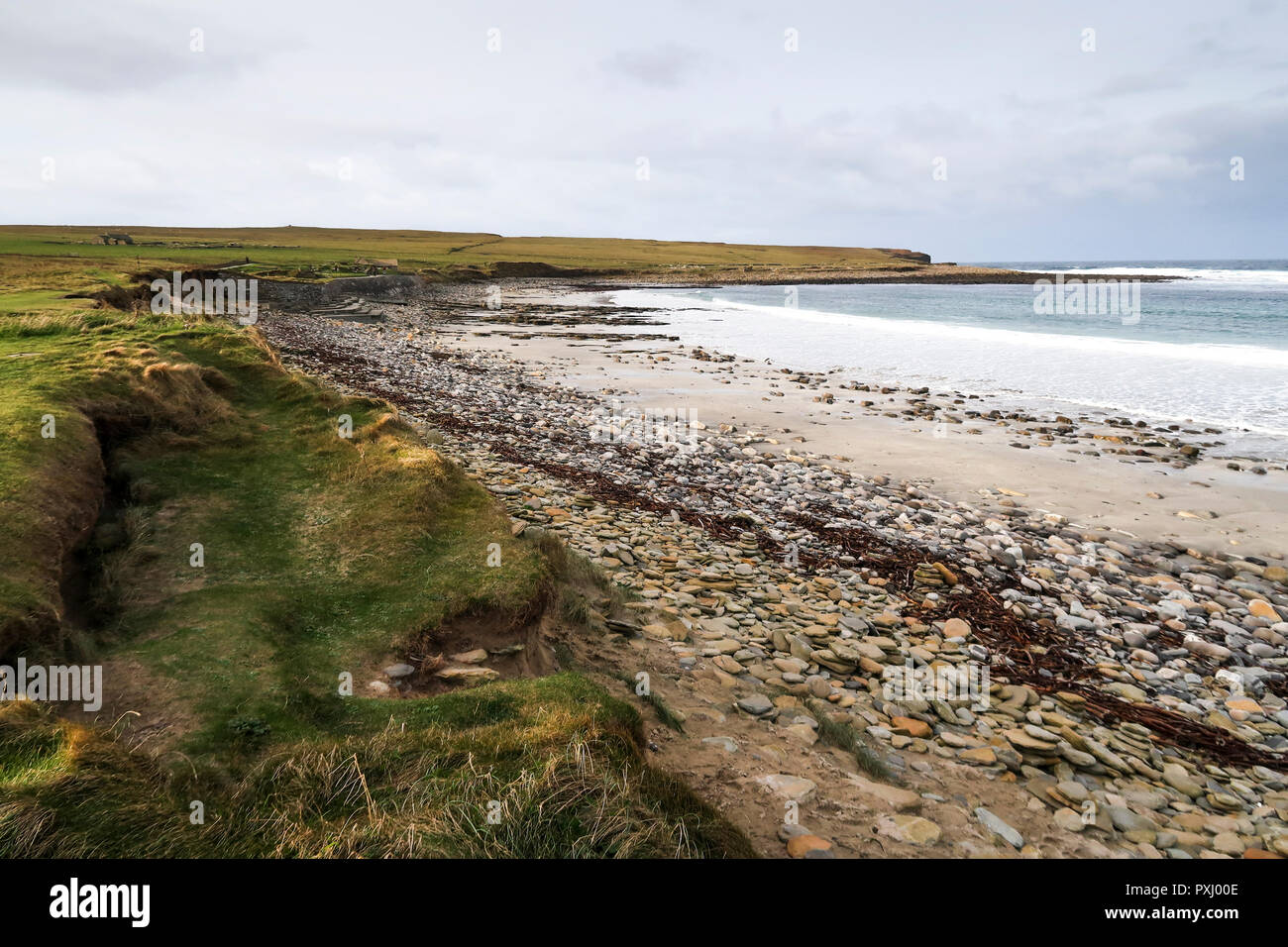 Sandy pebble beach in Orkney Stock Photo - Alamy