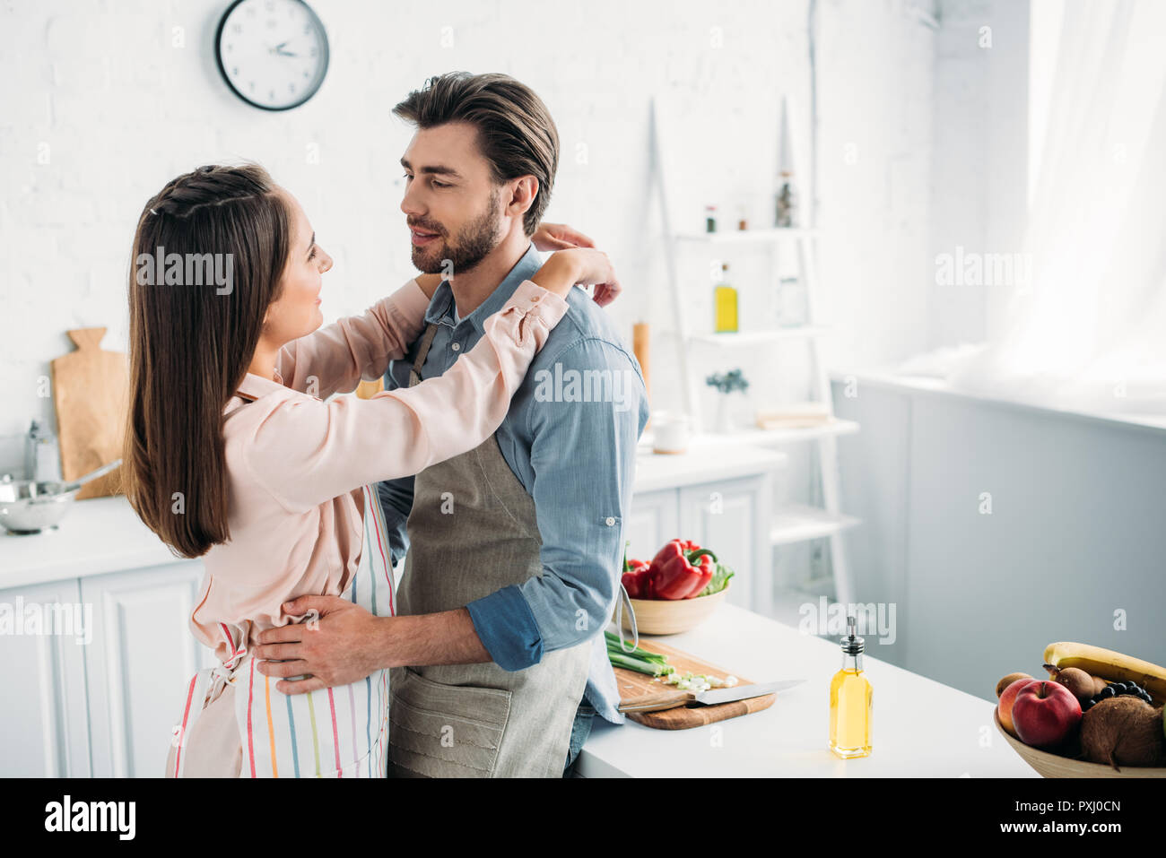 Couple leaning on kitchen counter hi-res stock photography and images ...