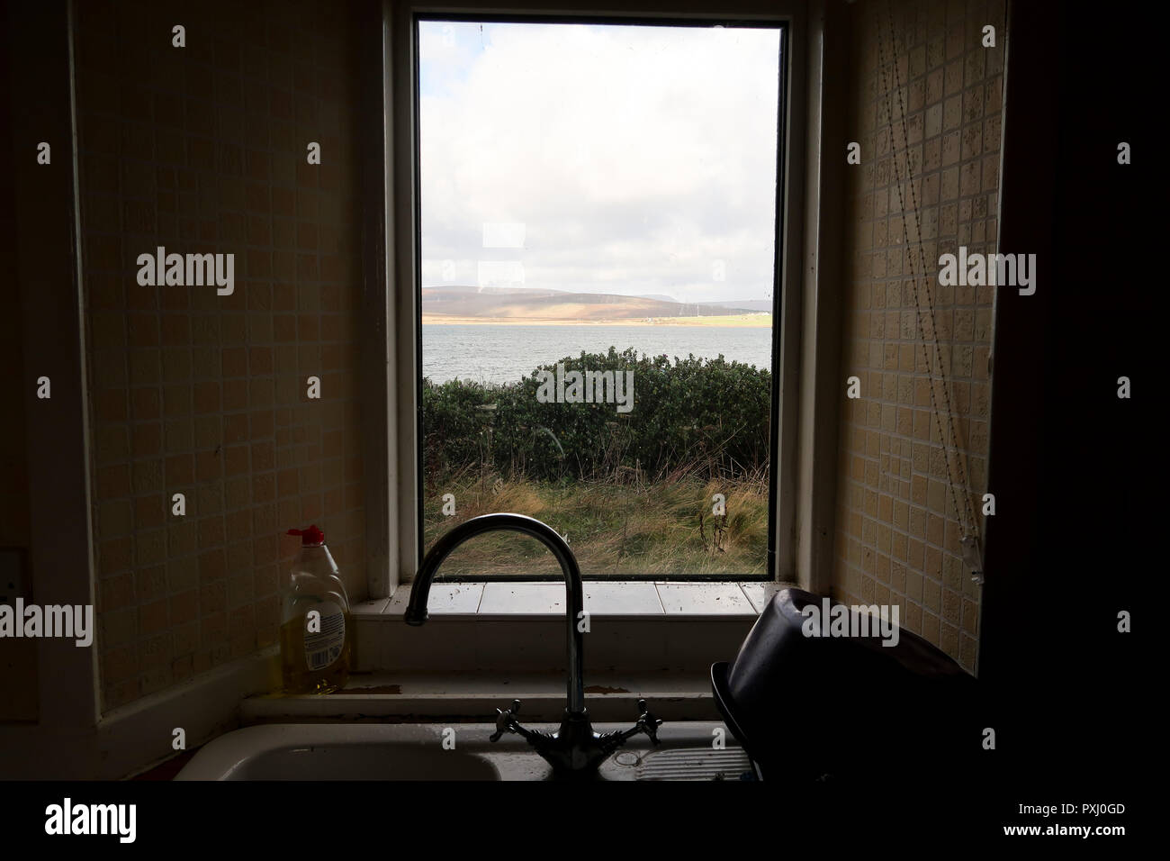 Coastal view through kitchen window Stock Photo - Alamy