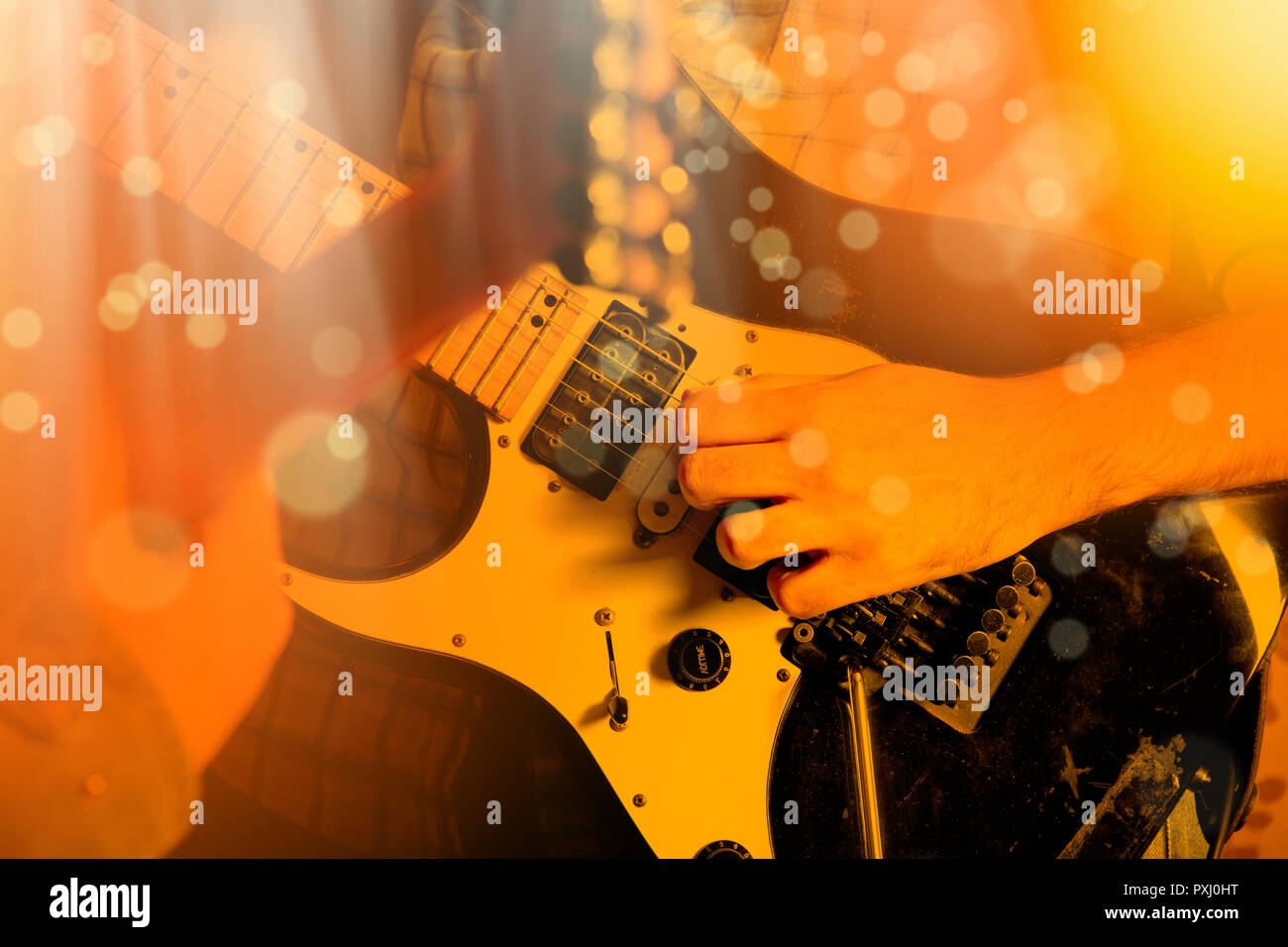 Life style image of close up young male guitarist hand, playing ...