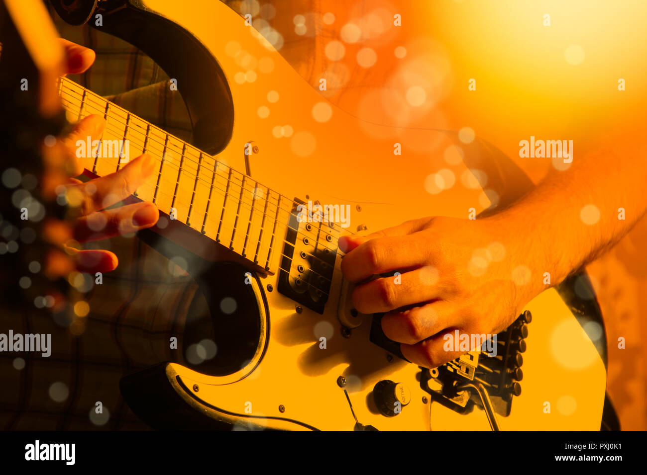 Life style image of close up young male guitarist hand, playing ...