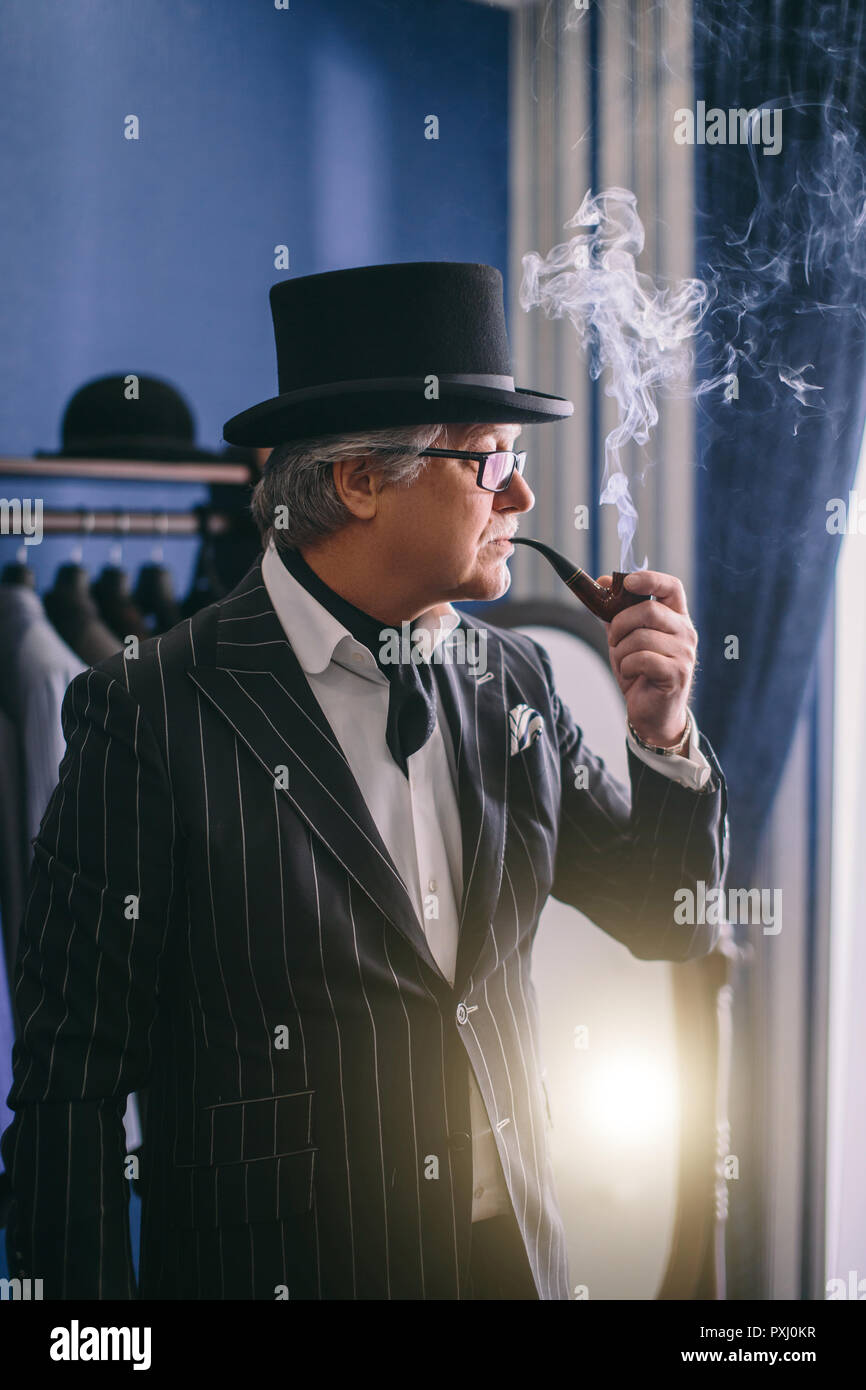 Portrait of posh mature gentleman visiting a tailor's shop Stock Photo ...