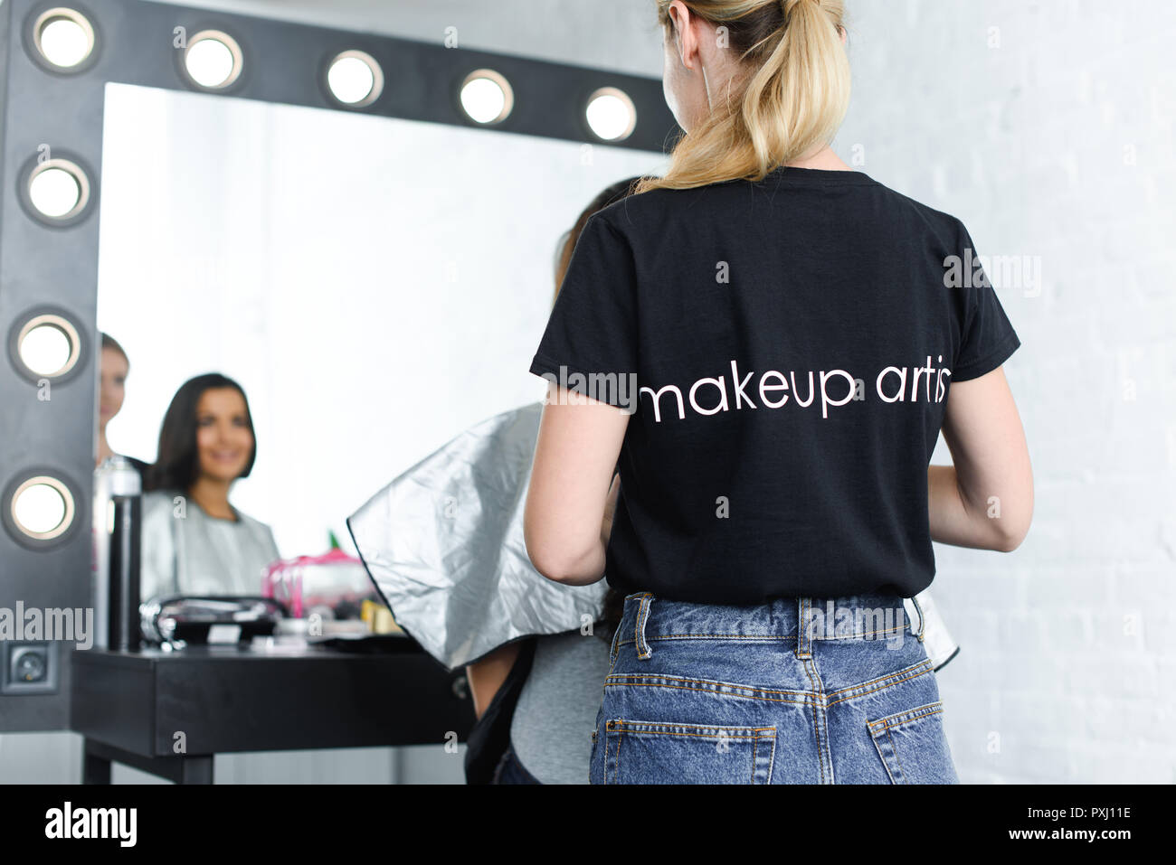 back view of makeup artist and model covered with cloth Stock Photo - Alamy