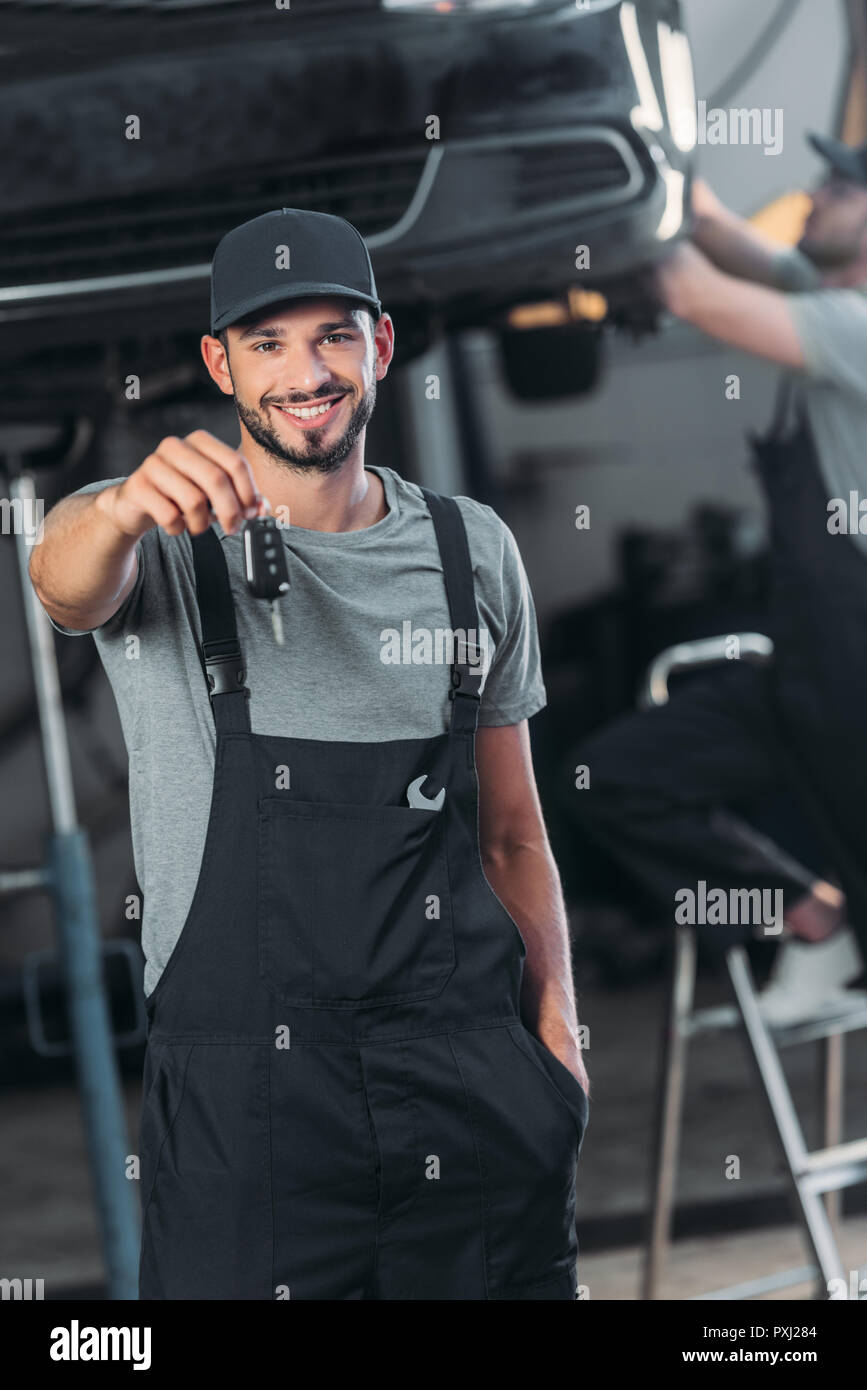 Cheerful male auto mechanic hi-res stock photography and images - Alamy