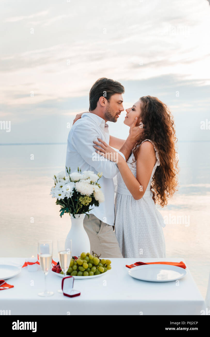 Couple kissing dinner table hi-res stock photography and images - Alamy