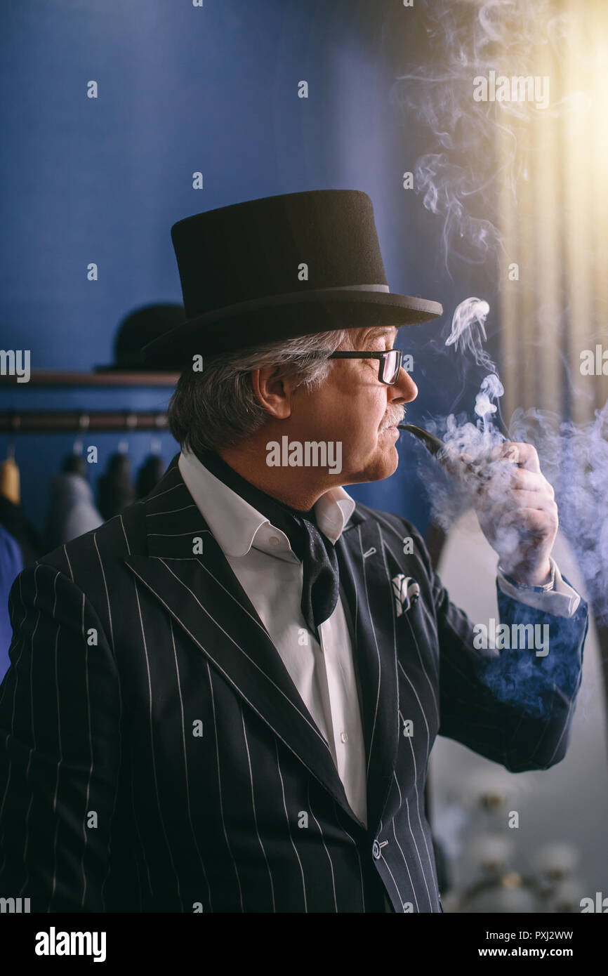 Portrait of posh mature gentleman visiting a tailor's shop Stock Photo ...