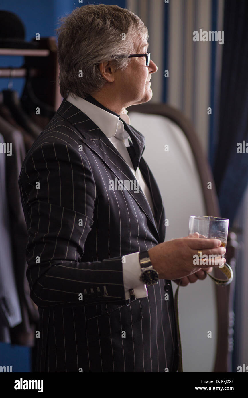 Portrait of posh mature gentleman visiting a tailor's shop Stock Photo ...