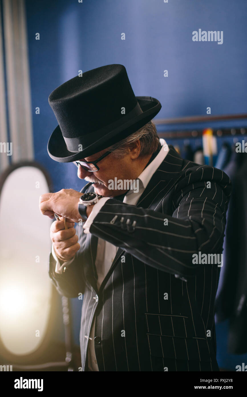 Portrait of posh mature gentleman visiting a tailor's shop Stock Photo ...
