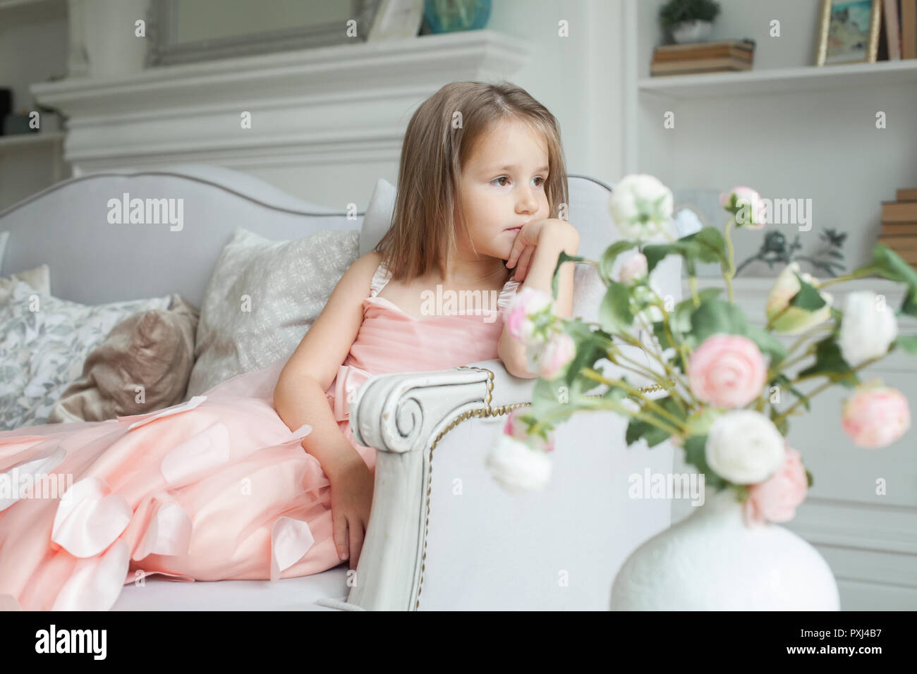 Bored child girl at home Stock Photo - Alamy