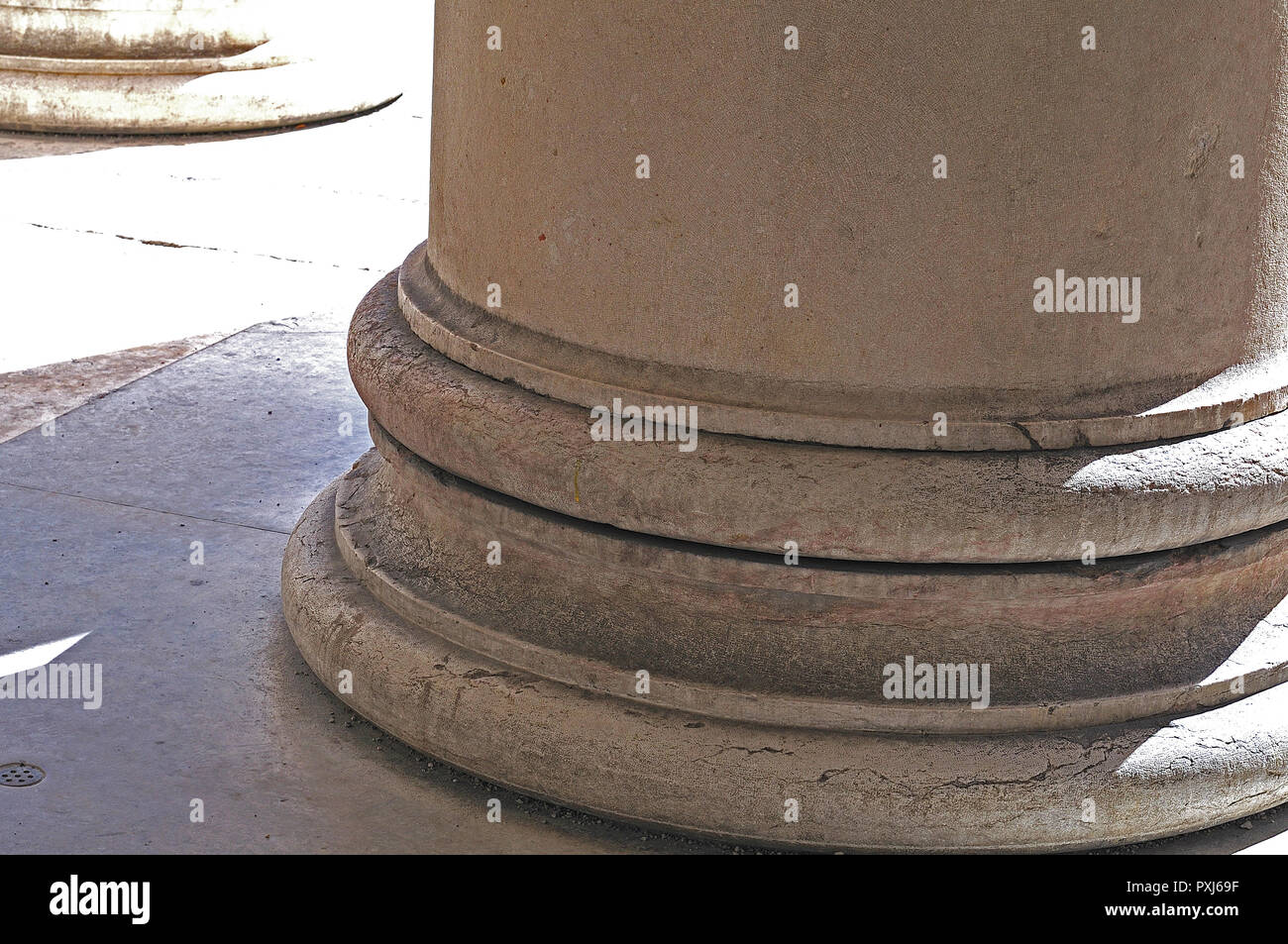 close-up of base of a classical column in bright sunlight Stock Photo ...
